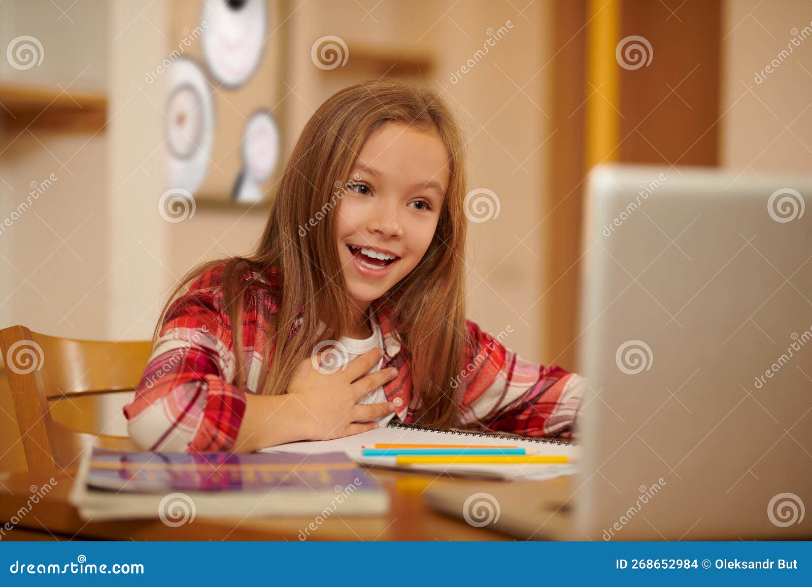 A Cute Long-haired Girl Having an Online Tutorial Stock Photo - Image ...