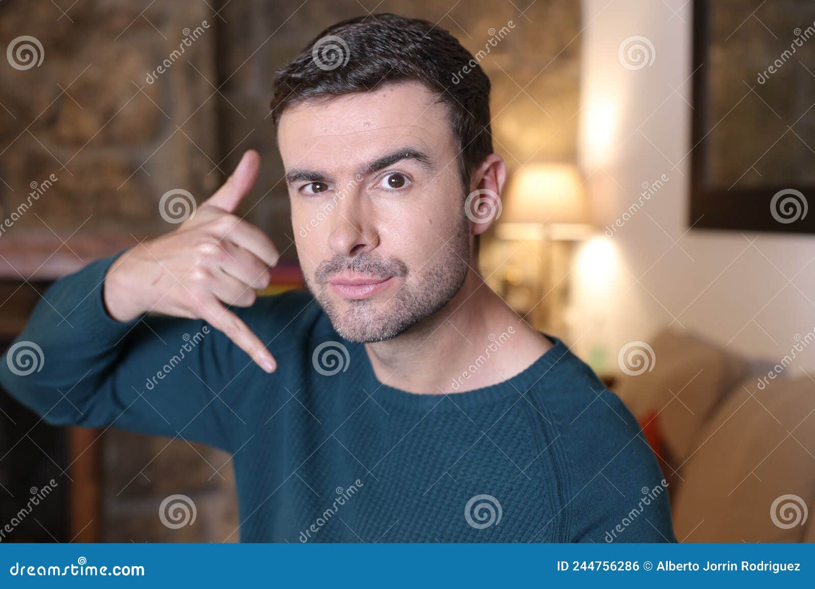 Cute Man Doing the `call Me` Gesture Stock Photo - Image of cheerful ...