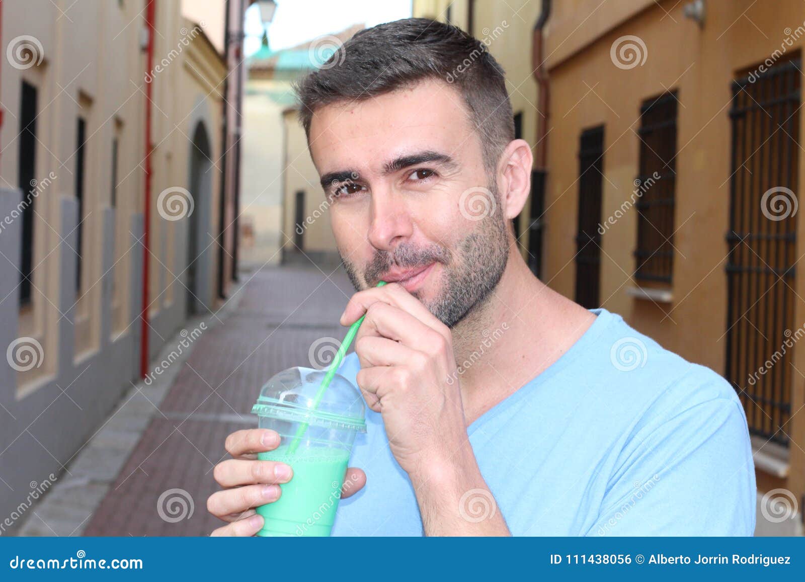 Cute Man Drinking a Shake Outdoors Stock Photo - Image of drinking ...
