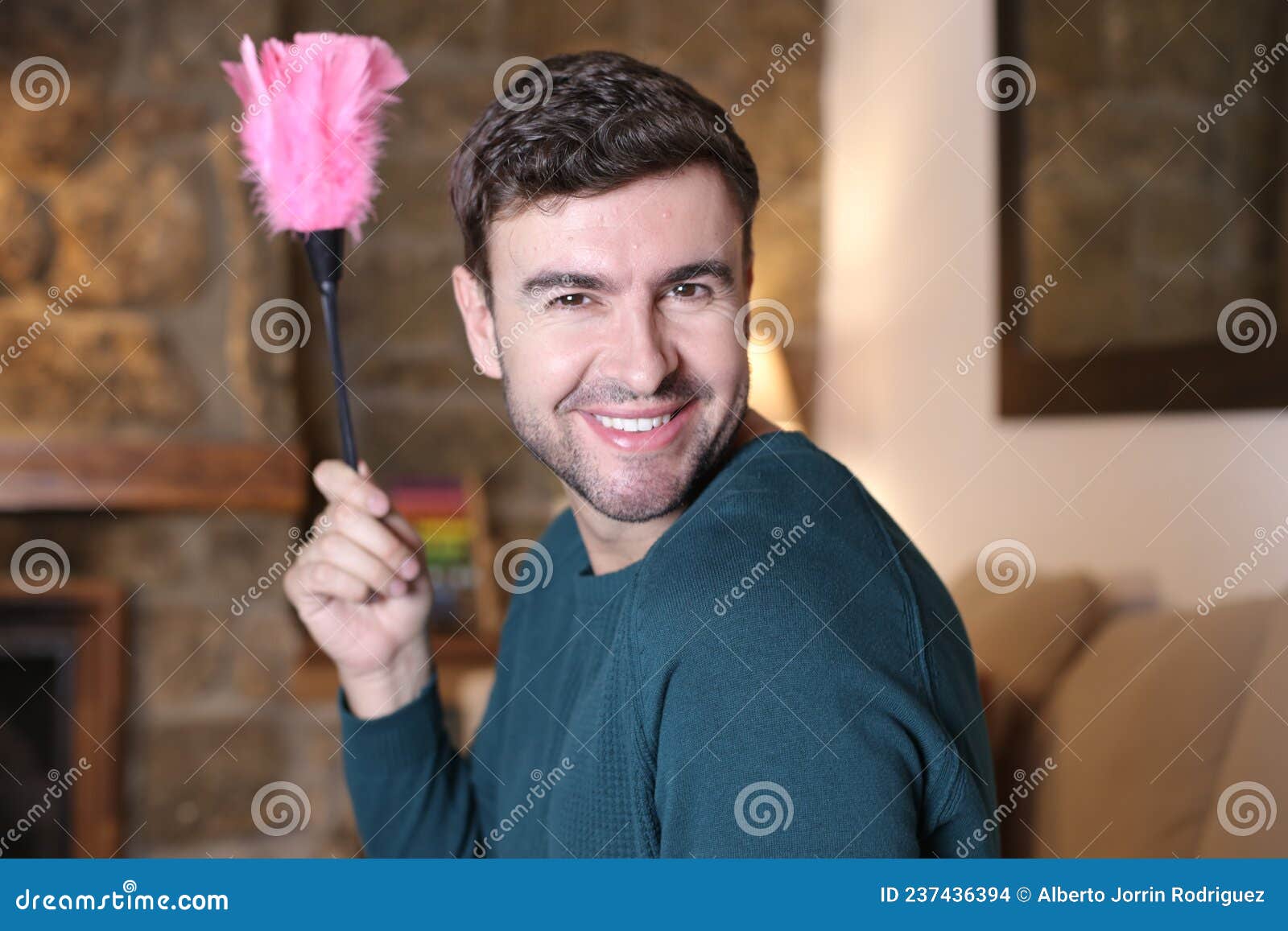 Cute Man Holding Pink Feather Duster Stock Photo - Image of male ...