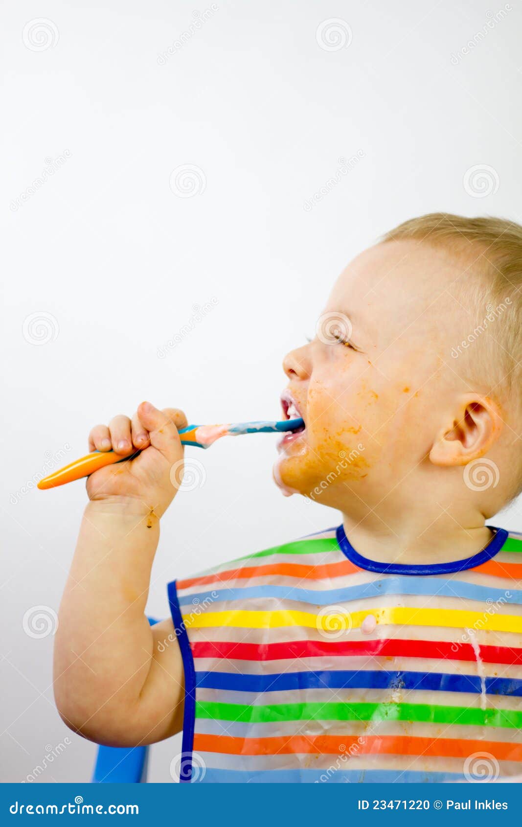 Cute Messy Infant Eating Side on Stock Photo - Image of shallow ...