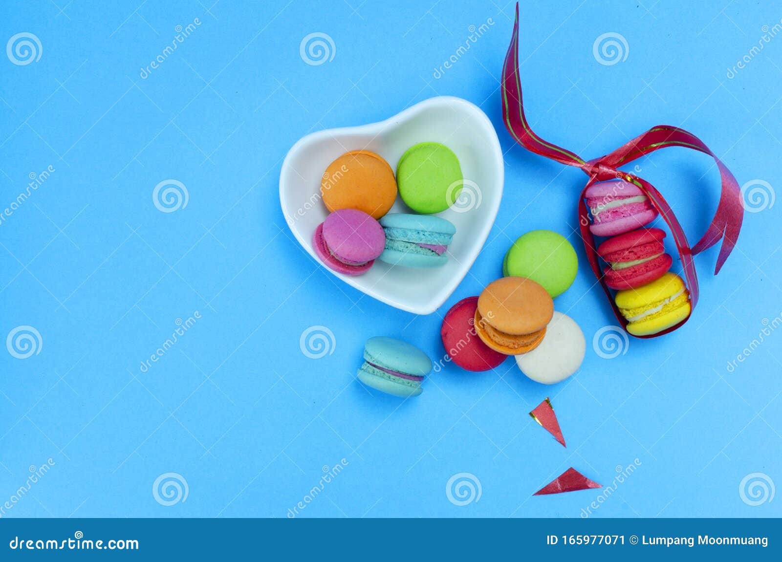 Cute Mini Macaroons Cookie with Ribbin Decoration on Blue Backgrounds ...