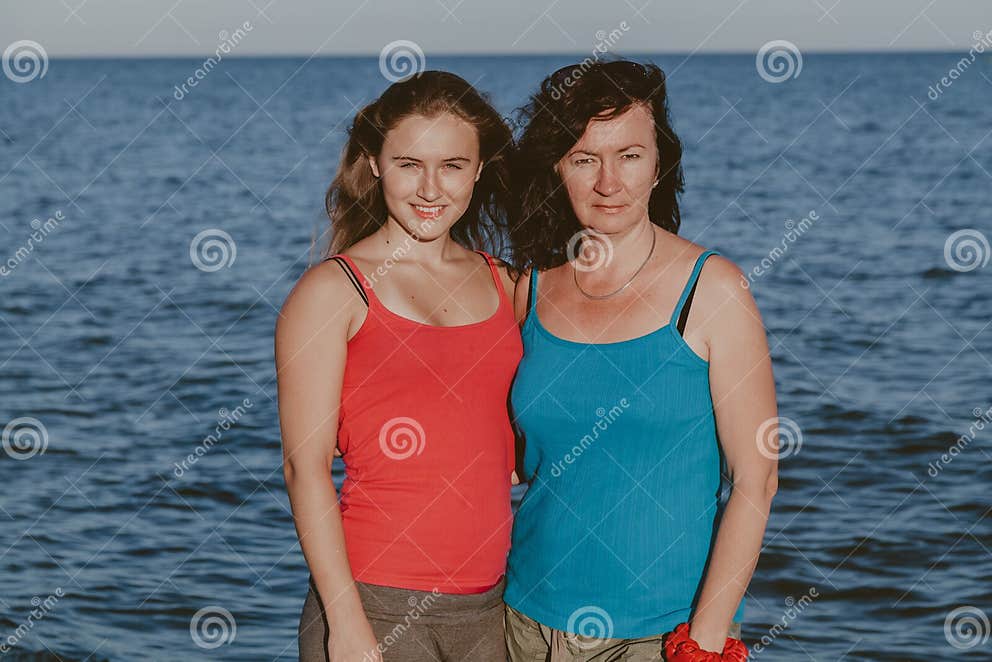 Cute Mommy And Adult Daughter Stand On Seashore Stock Image Image Of