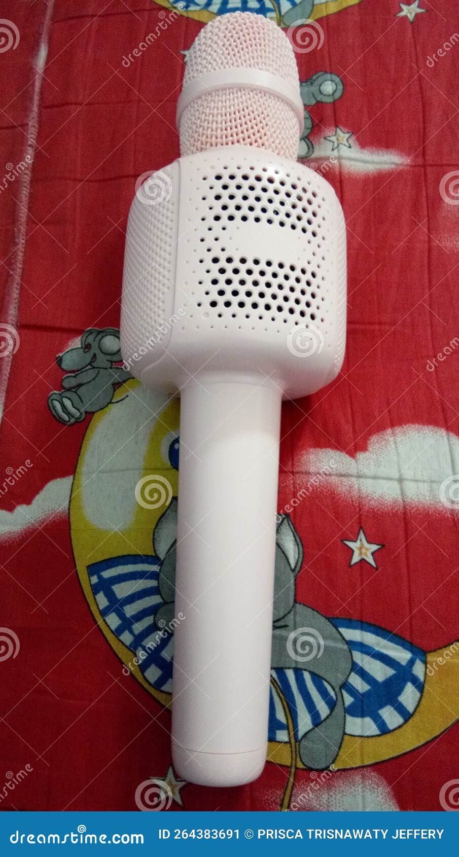 A Cute Pink Bluetooth Microphone on the Bed Stock Image - Image of ...