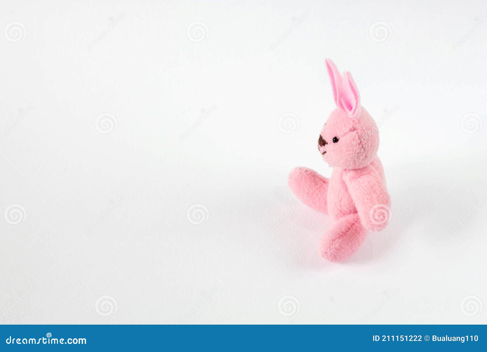 A Cute Pink Rabbit is Sitting on White Background. Stock Photo - Image ...