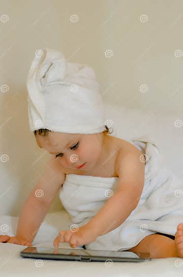 Cute Portrait Of A Young Girl Getting Out Of The Bath And Playing With