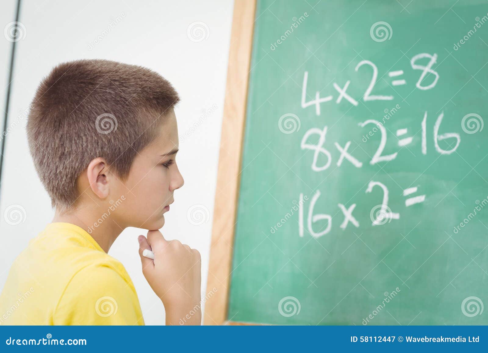 Cute Pupil Calculating on Chalkboard in a Classroom Stock Image - Image ...