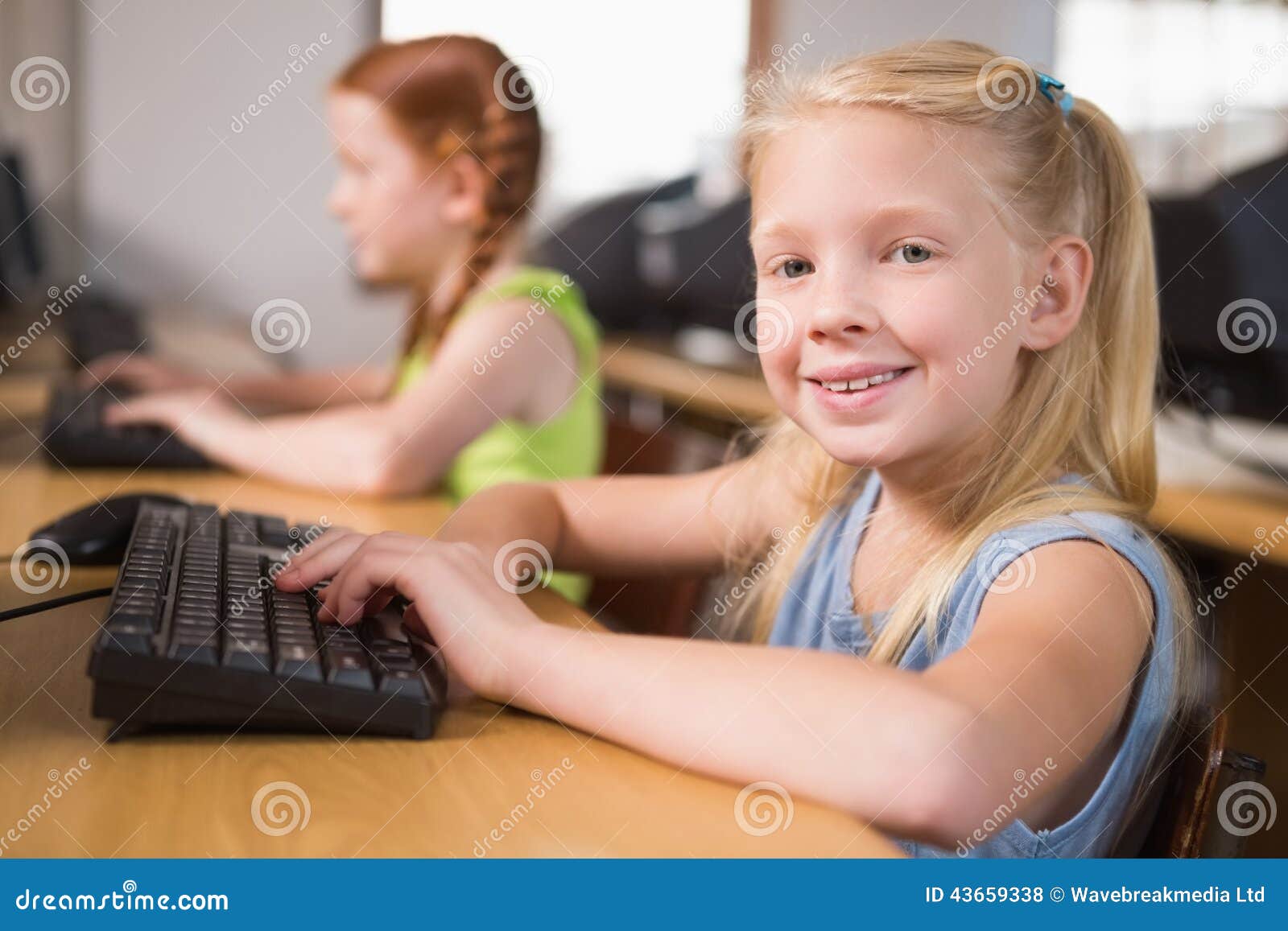 Cute Pupil in Computer Class Smiling at Camera Stock Photo - Image of ...