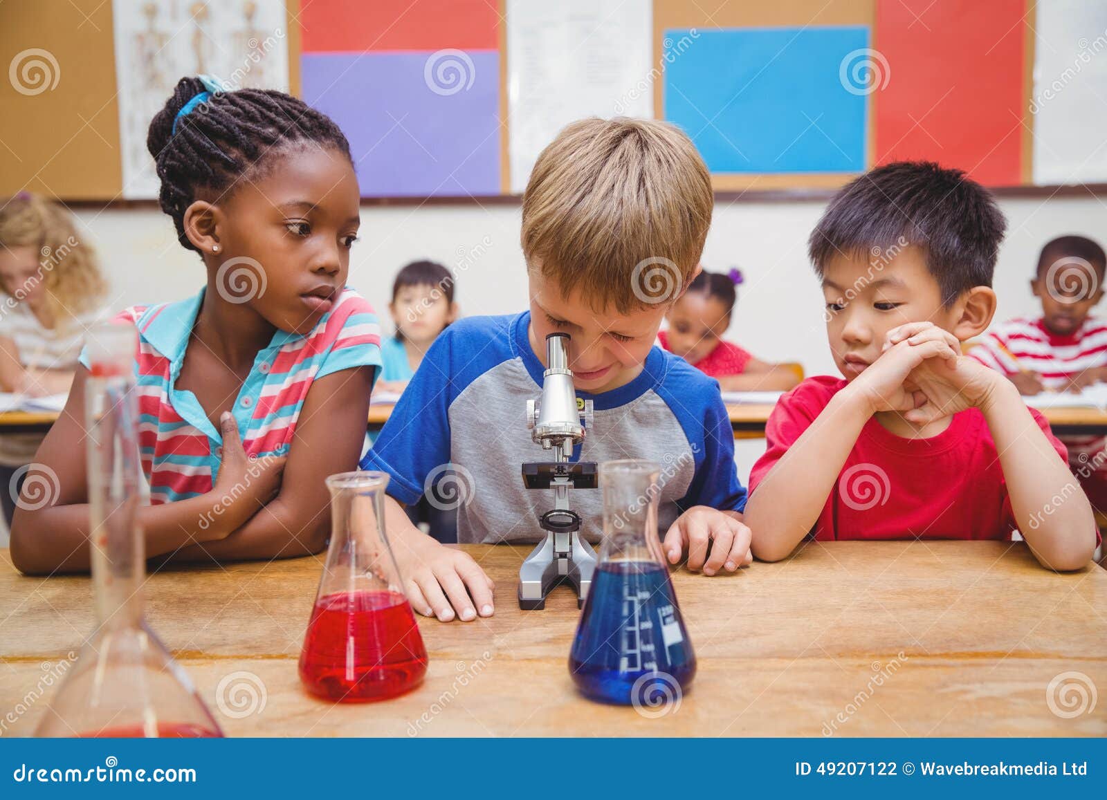 Cute Pupil Looking through Microscope Stock Photo - Image of childhood ...