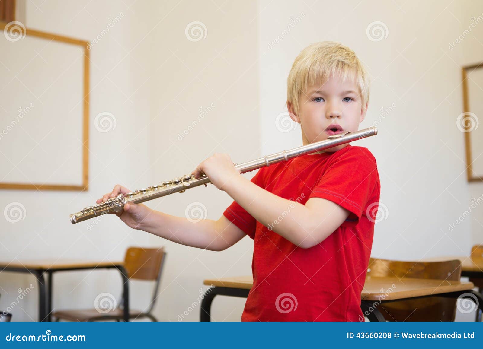 Cute Pupil Playing Flute in Classroom Stock Photo - Image of cute ...