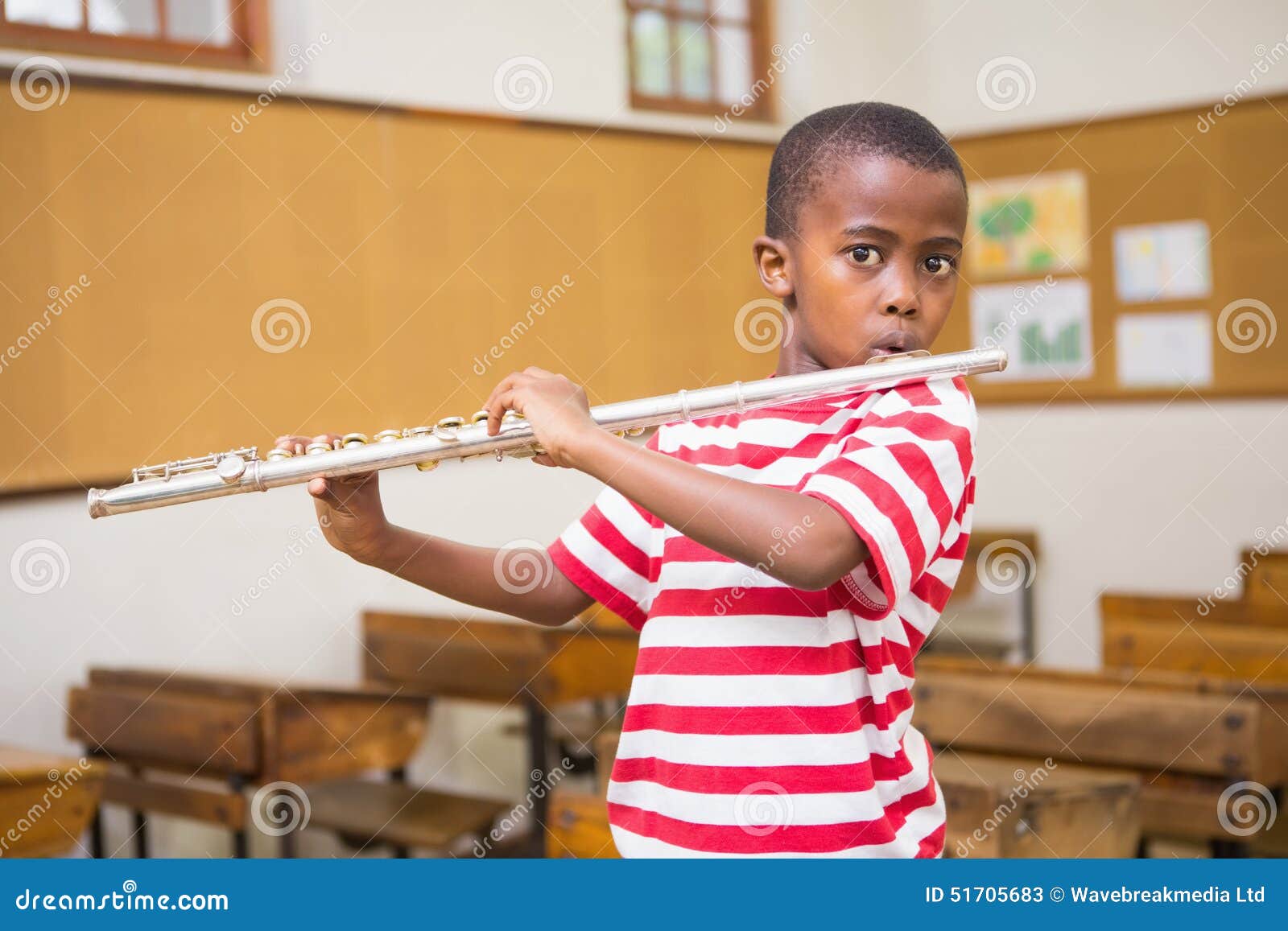 Cute Pupil Playing Flute in Classroom Stock Image - Image of serious ...