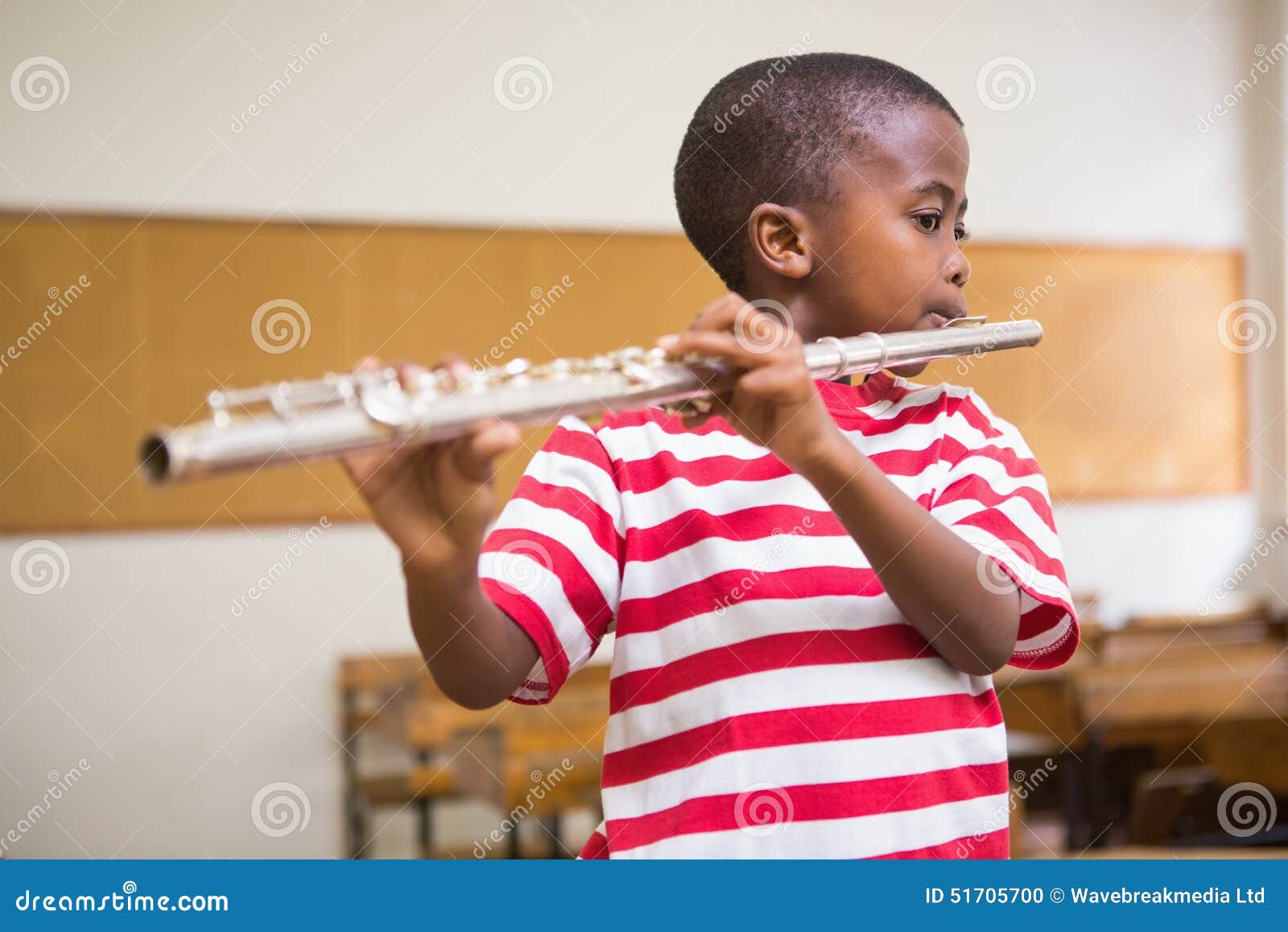 Cute Pupil Playing Flute in Classroom Stock Photo - Image of ...
