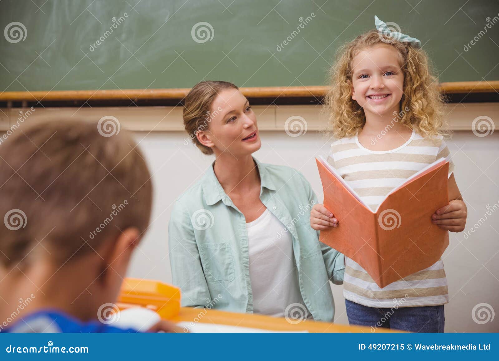 Cute Pupil Smiling at Camera during Class Presentation Stock Image ...