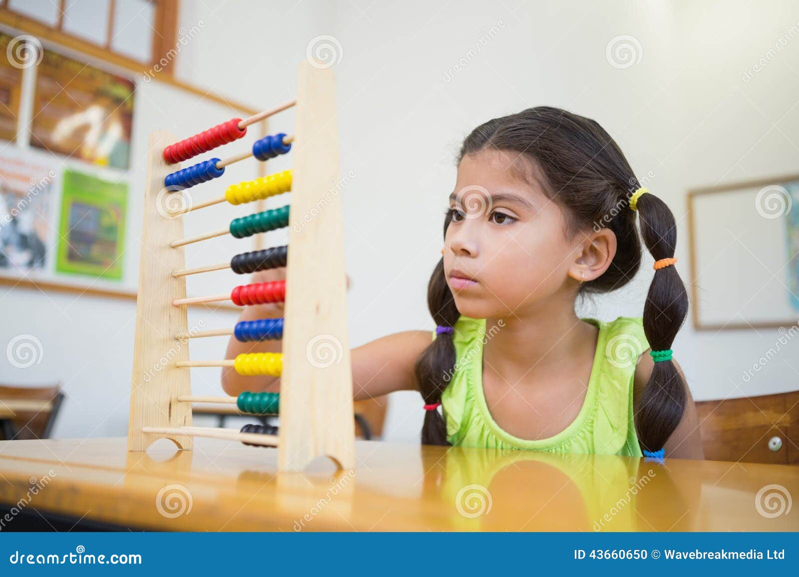 Cute Pupil Using Abacus in Classroom Stock Photo - Image of side ...