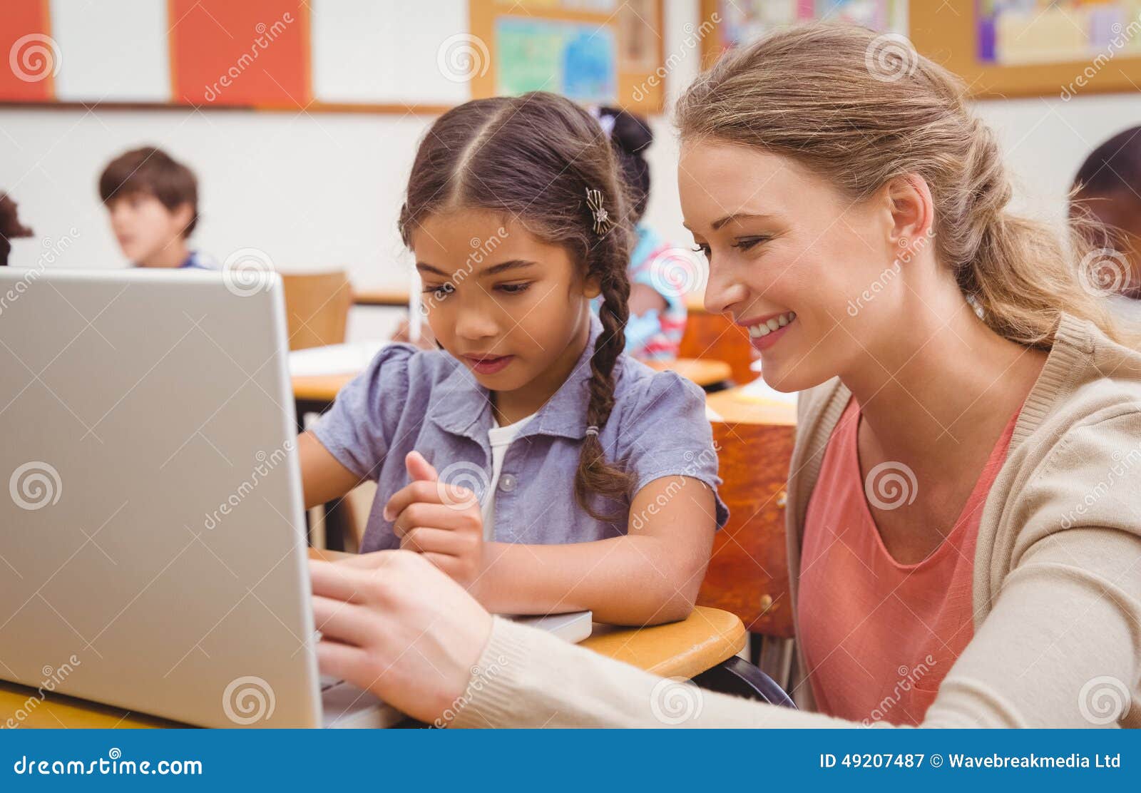 Cute Pupil Using Computer with Teacher Stock Image - Image of ...