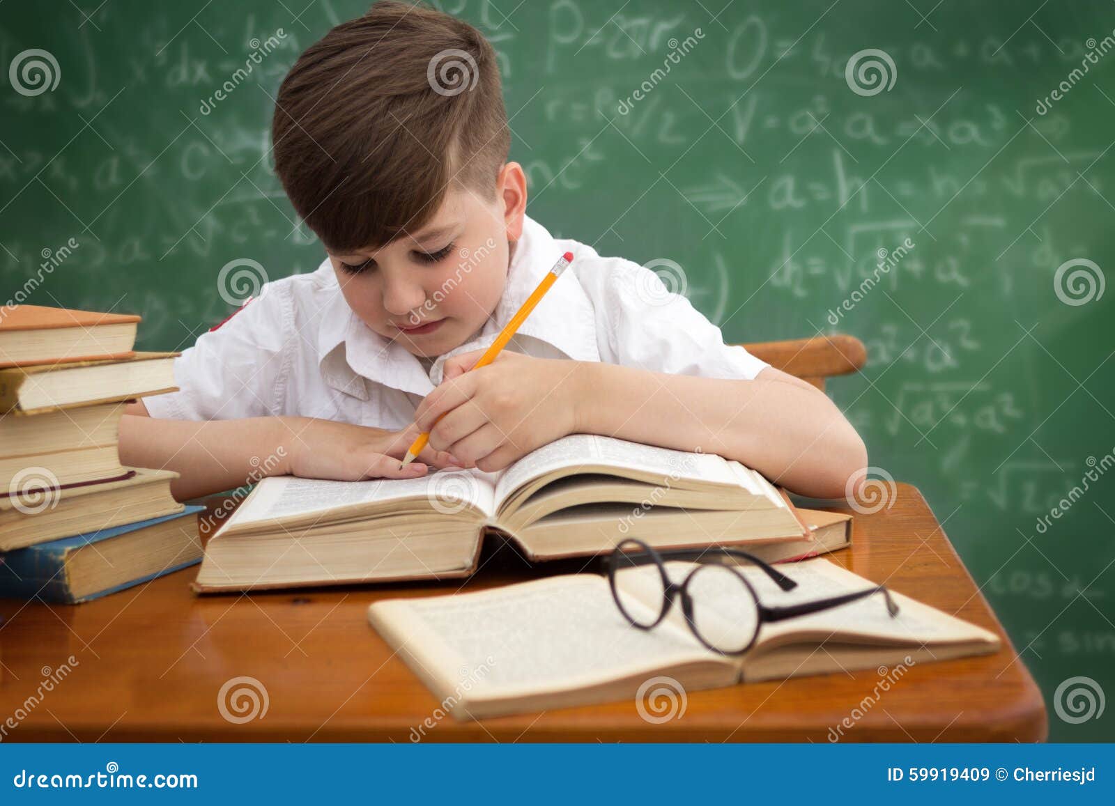 Cute Pupil Writing At Desk Stock Image | CartoonDealer.com #59919409