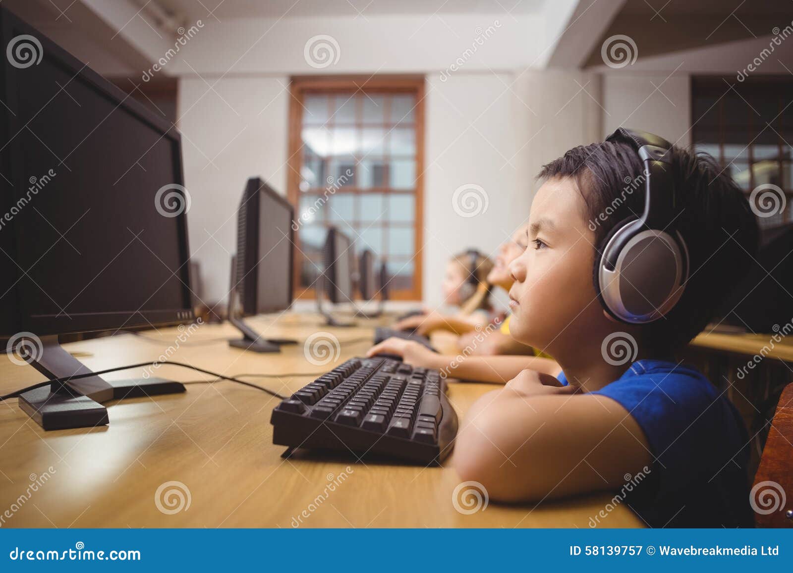 Cute Pupils in Computer Class Stock Image - Image of classroom, focused ...