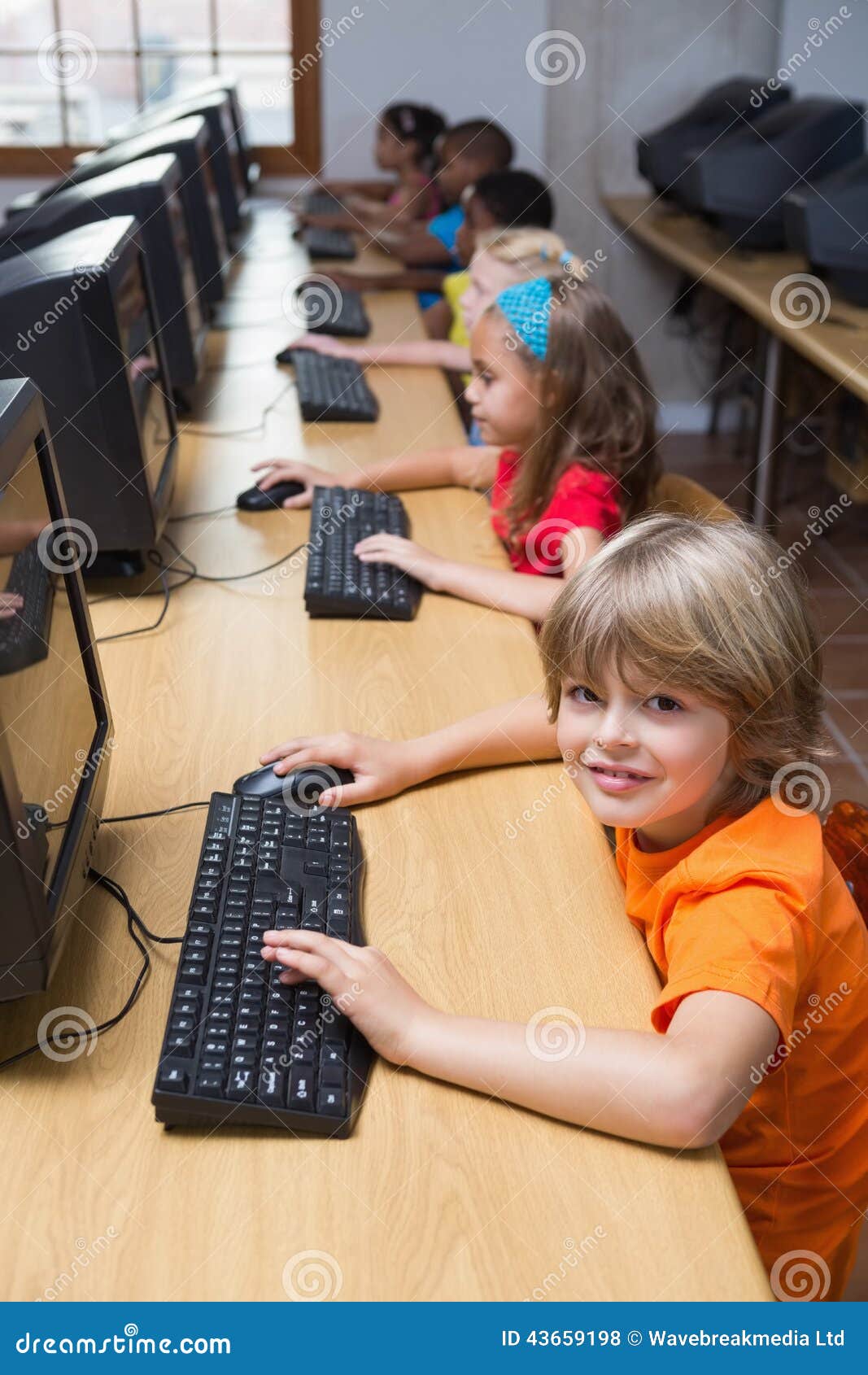 Cute Pupils in Computer Class Stock Photo - Image of four, smiling ...