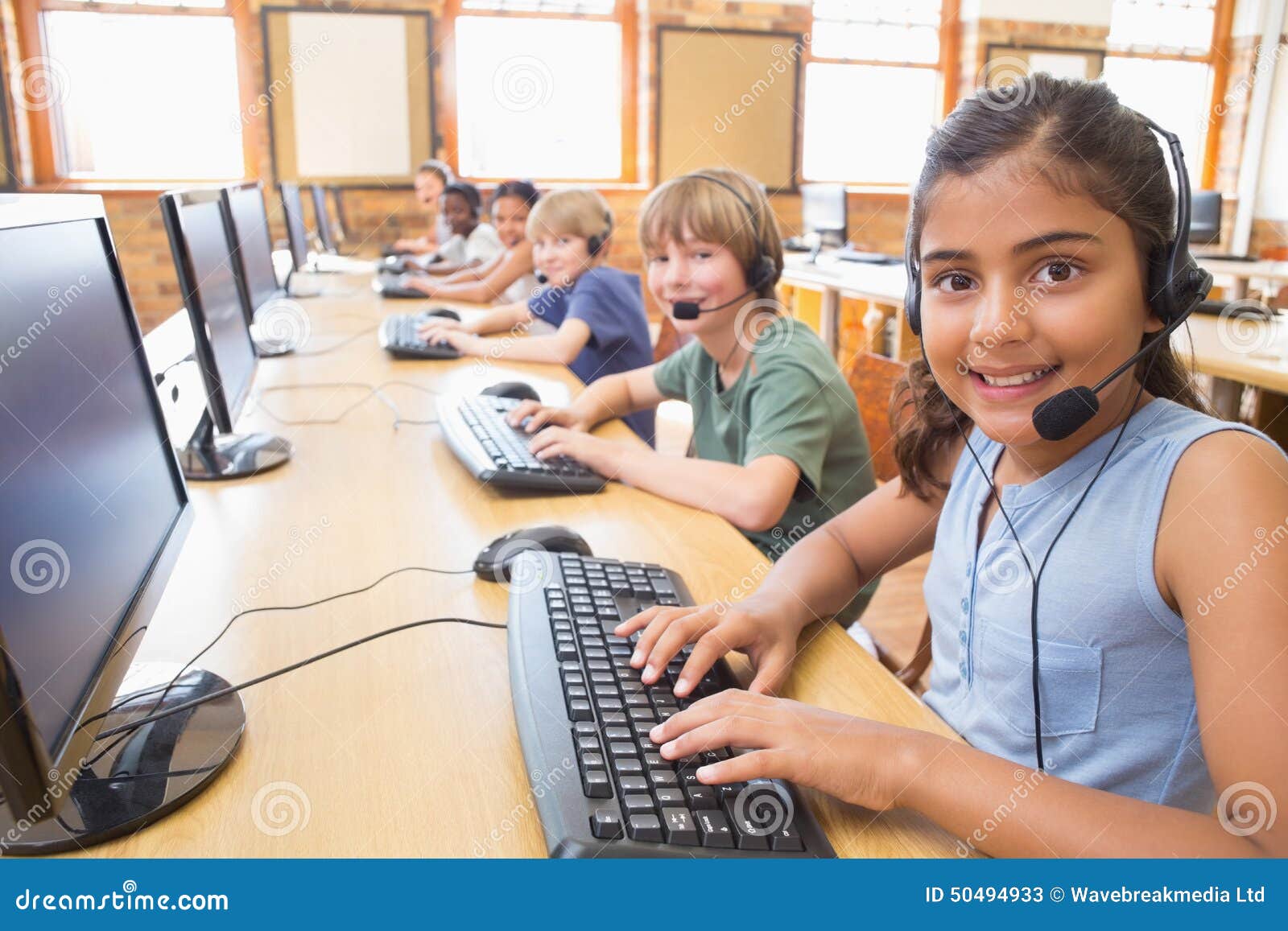 Cute Pupils in Computer Class Stock Image - Image of medium, indoors ...