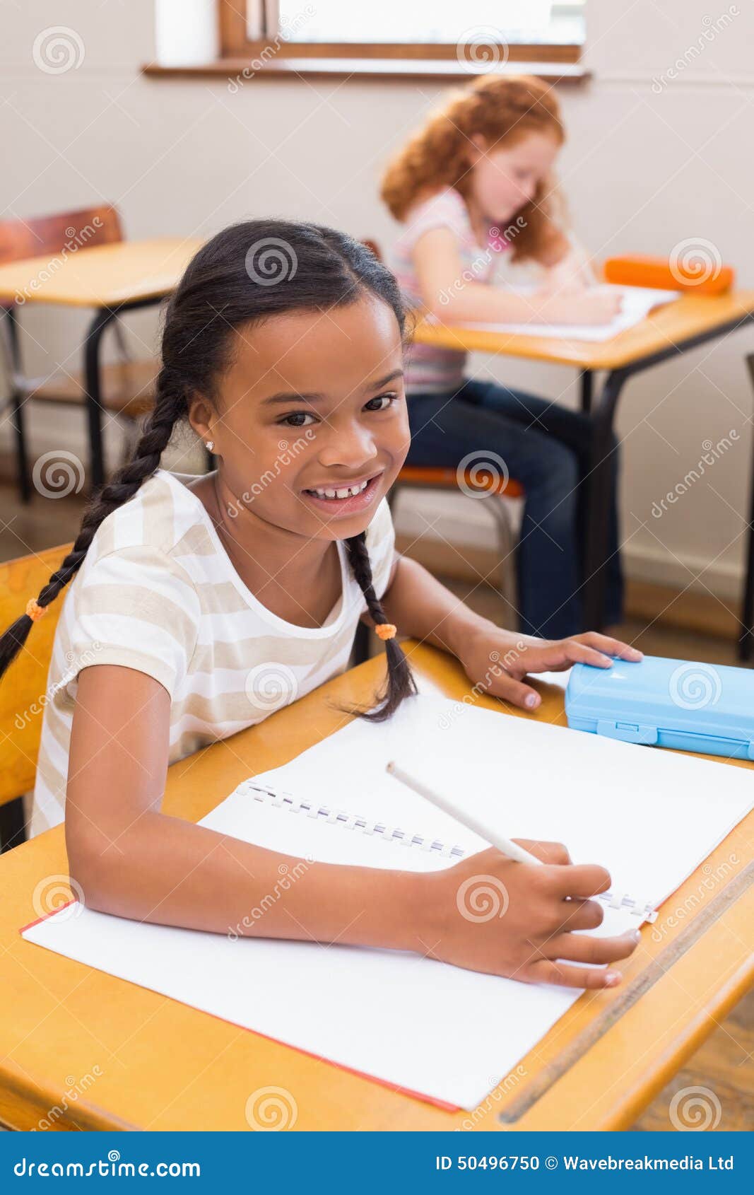 Cute Pupils Drawing at Their Desks One Smiling at Camera Stock Photo ...