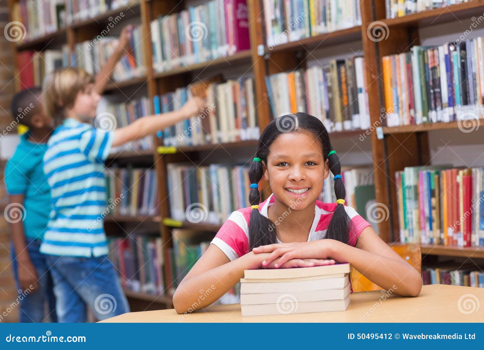 Cute Pupils Looking for Books in Library Stock Photo - Image of ...