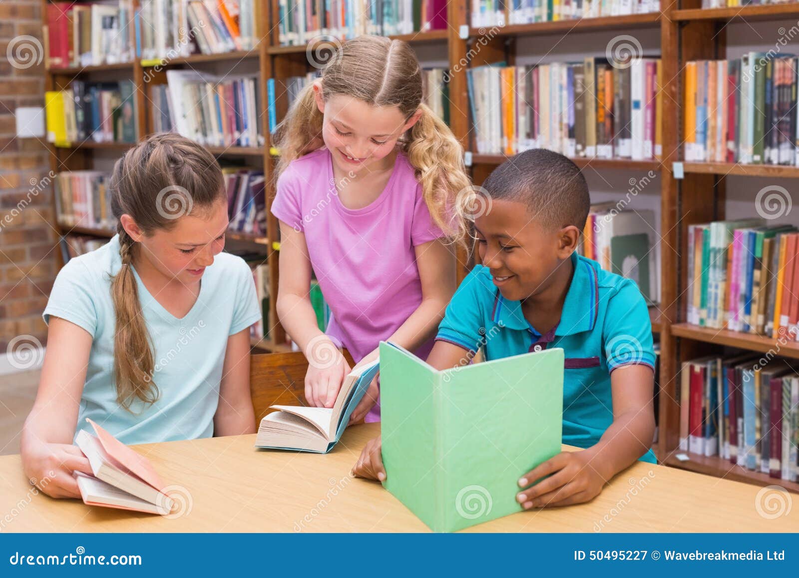 Cute Pupils Reading in Library Stock Image - Image of book, caucasian ...