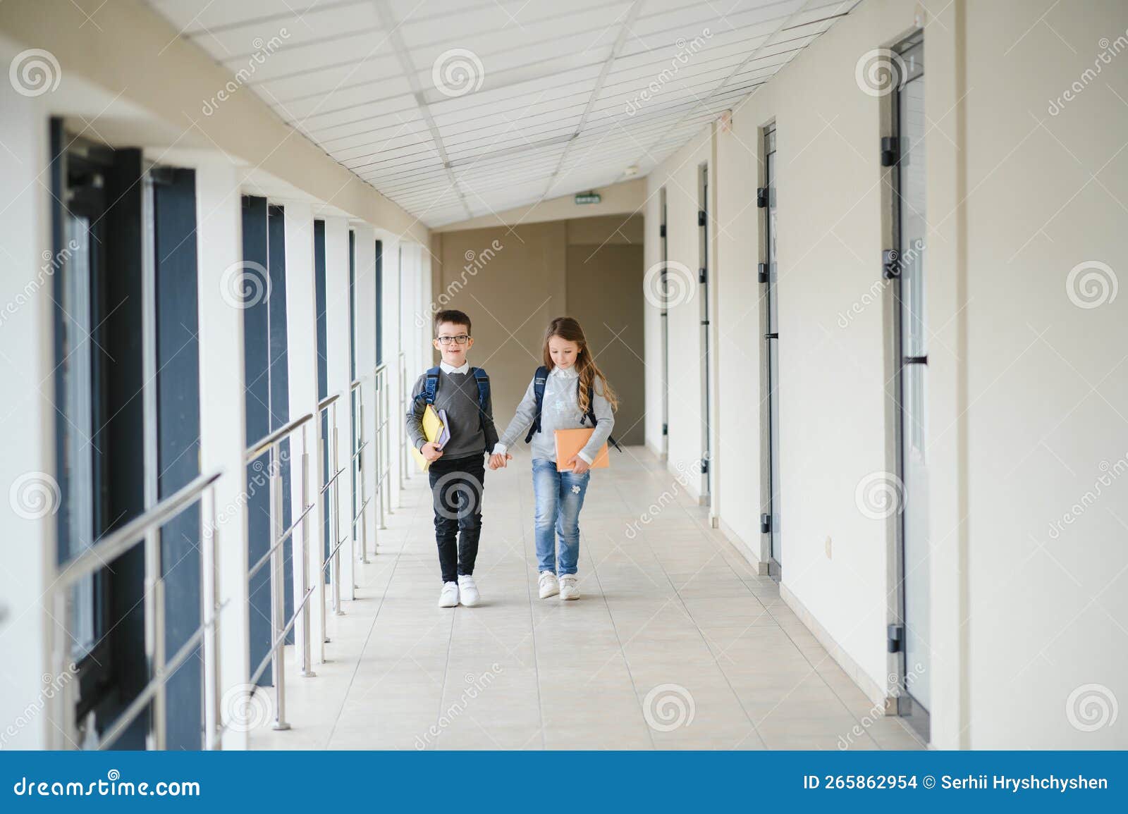 Cute Pupils Running Down the Hall at the Elementary School Stock Photo ...