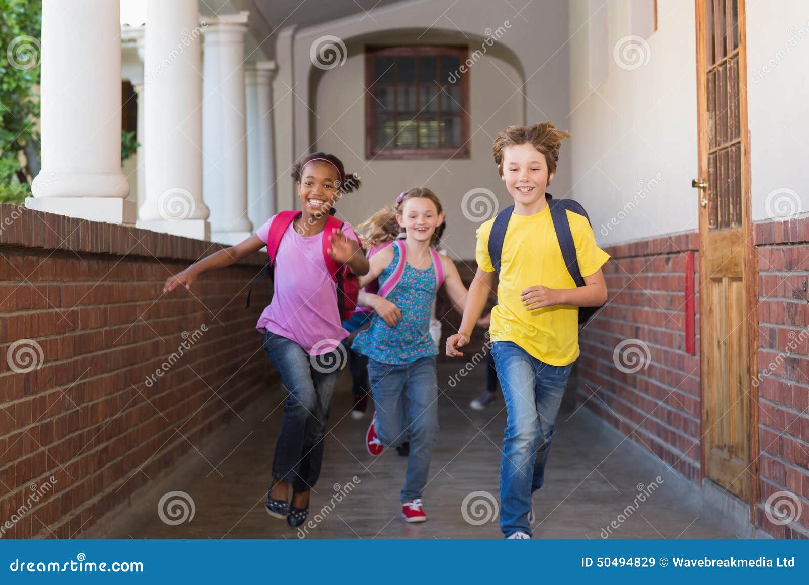 Cute Pupils Running Down the Hall Stock Image - Image of school ...