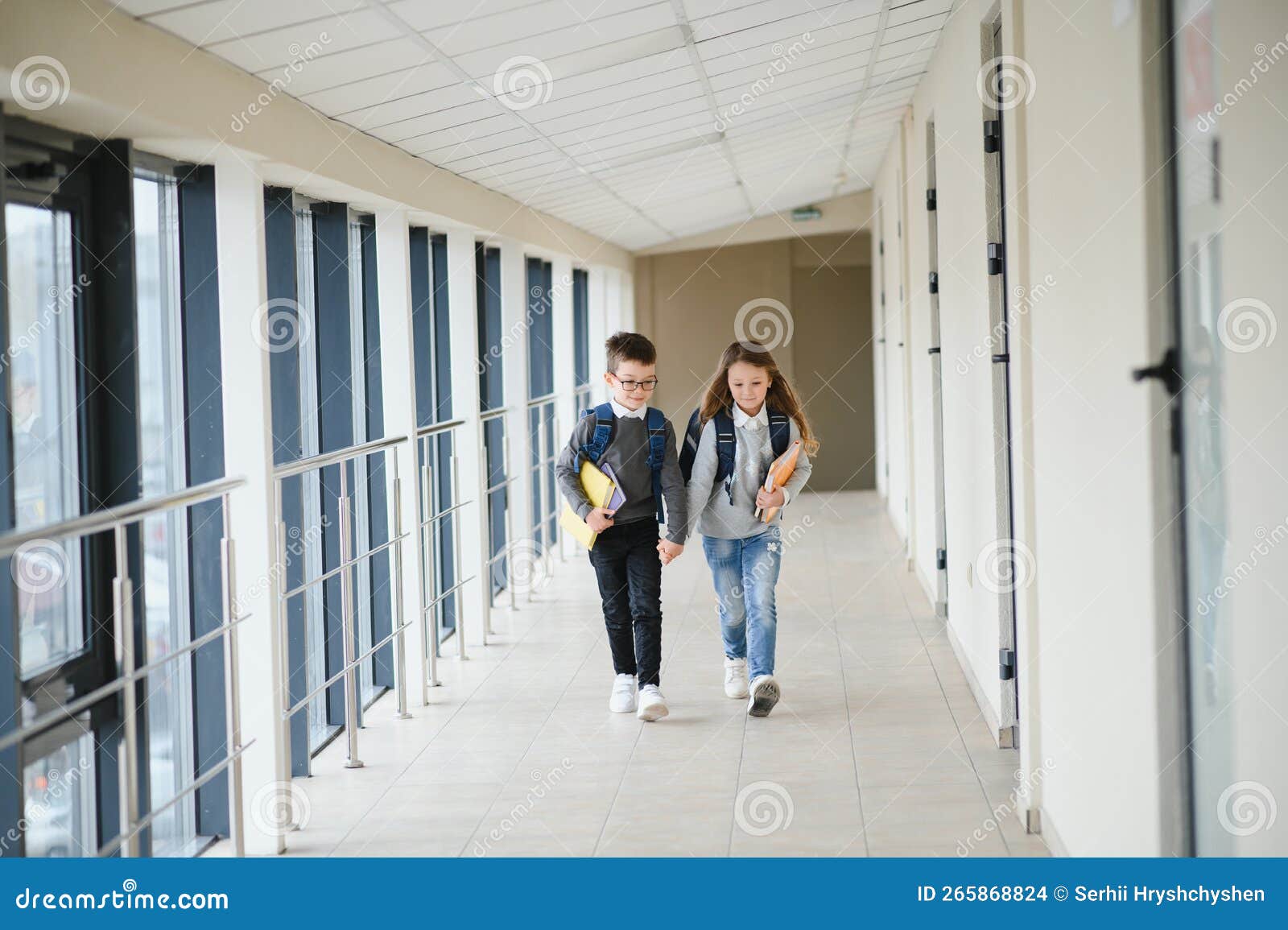 Cute Pupils Running Down the Hall at the Elementary School Stock Photo ...