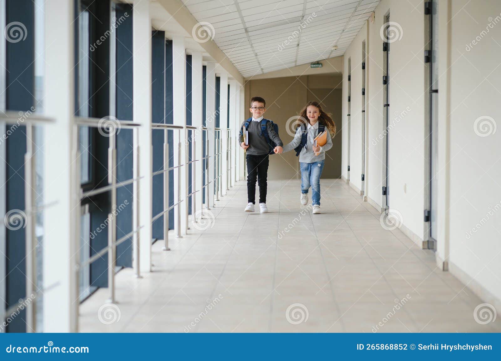 Cute Pupils Running Down the Hall at the Elementary School Stock Photo ...