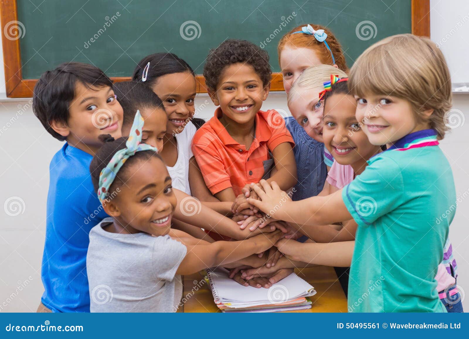 Cute Pupils Smiling at Camera in Classroom Stock Image - Image of ...