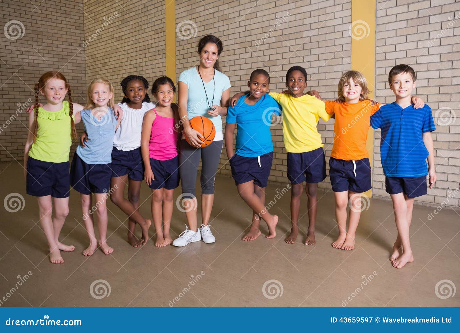 Cute Pupils Smiling at Camera with PE Teacher Stock Image - Image of ...