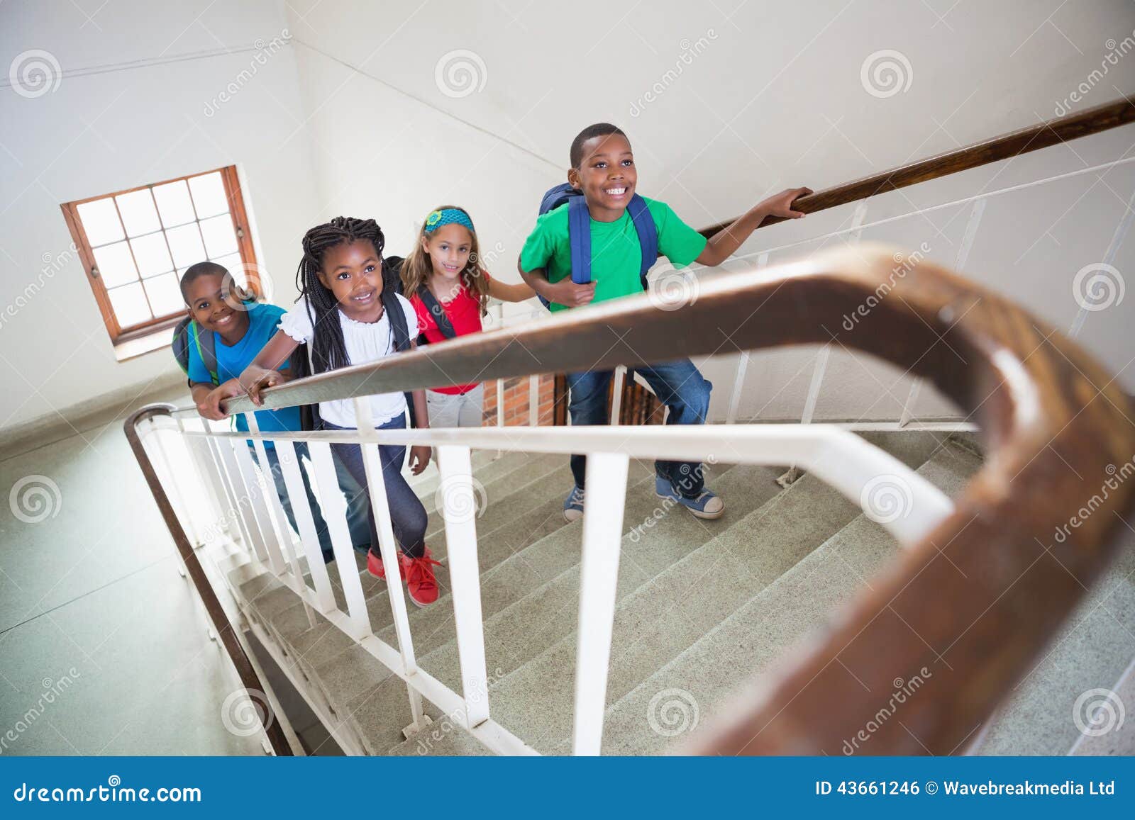 Cute Pupils Smiling and Walking Up Stairs Stock Photo - Image of hall ...