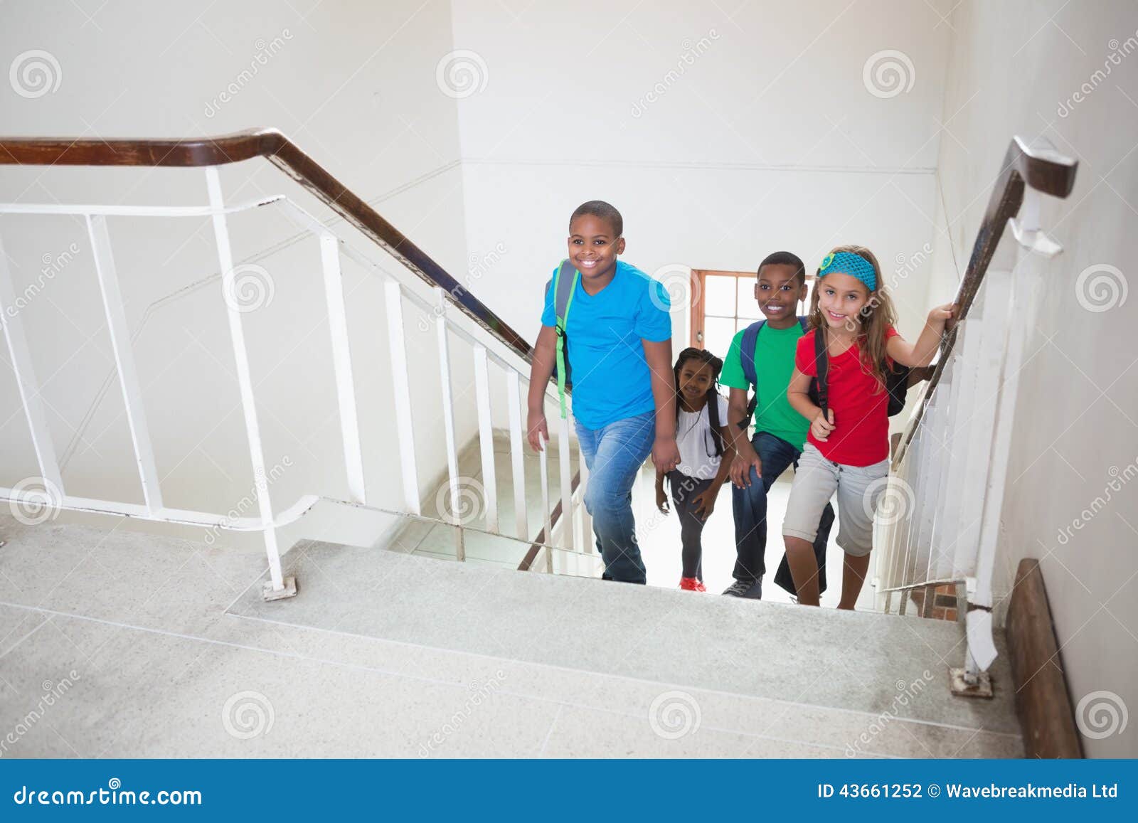 Cute Pupils Smiling and Walking Up Stairs Stock Photo - Image of male ...