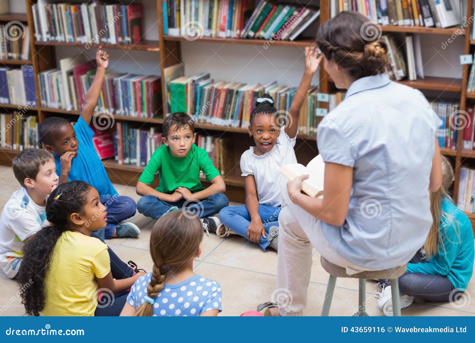 Cute Pupils and Teacher Having Class in Library Stock Photo - Image of ...