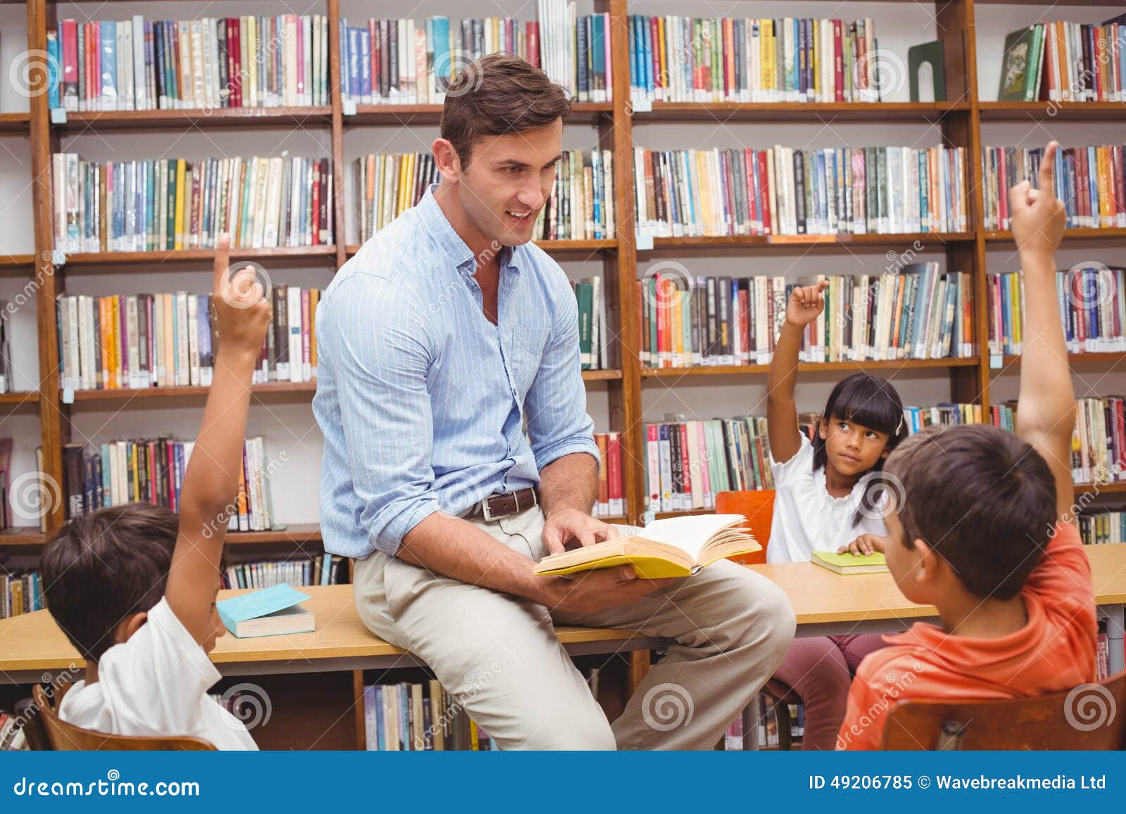 Cute Pupils and Teacher Having Class in Library Stock Image - Image of ...