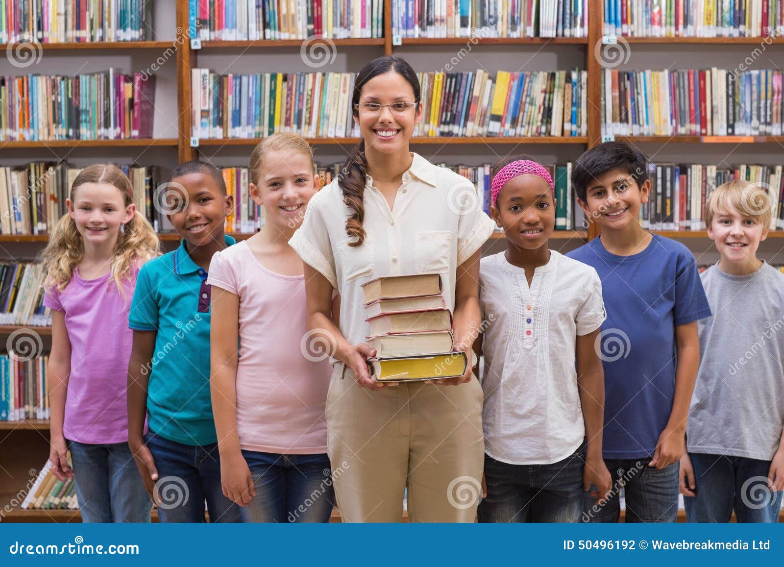 Cute Pupils and Teacher Having Class in Library Stock Photo - Image of ...