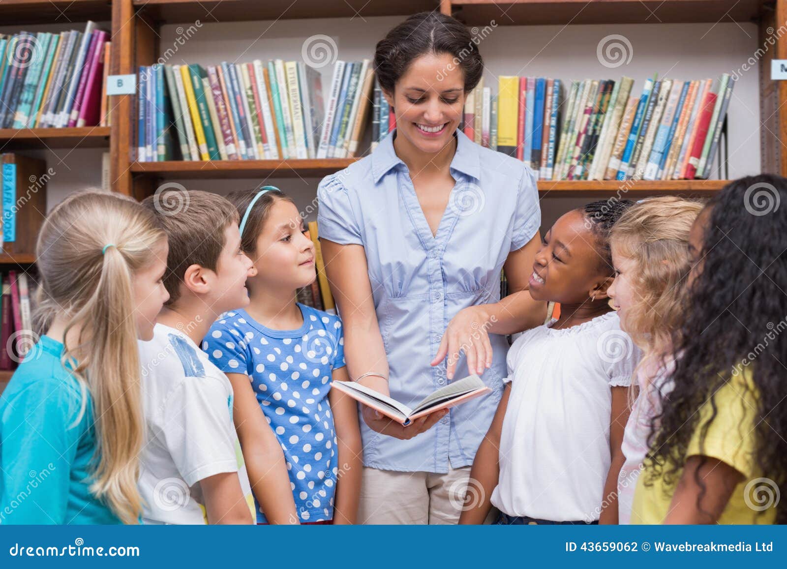 Cute Pupils and Teacher Reading Book in Library Stock Photo - Image of ...