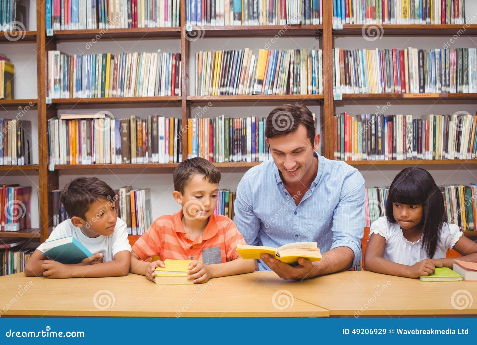 Cute Pupils and Teacher Reading in Library Stock Image - Image of child ...
