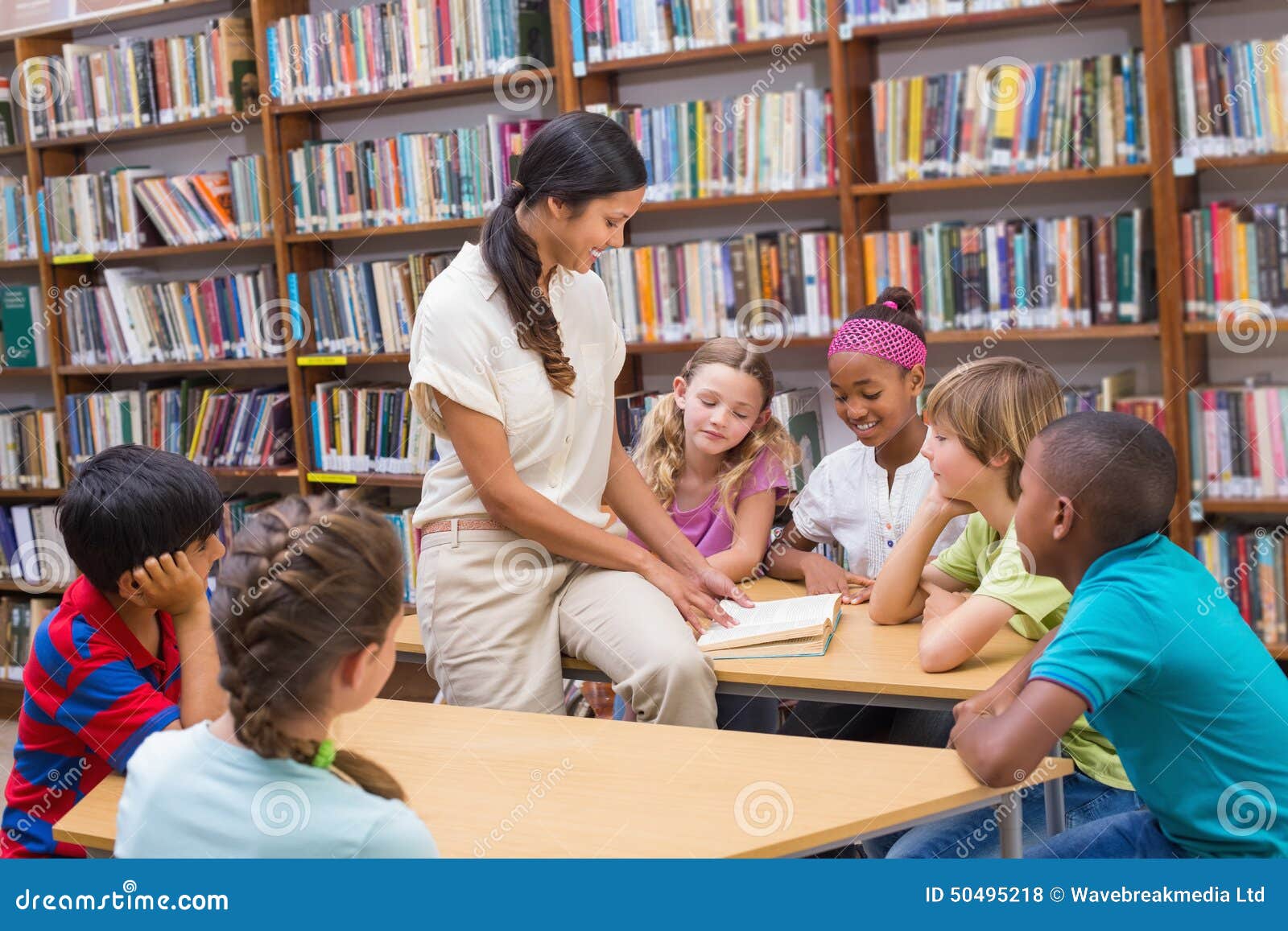 Cute Pupils and Teacher Reading in Library Stock Photo - Image of class ...