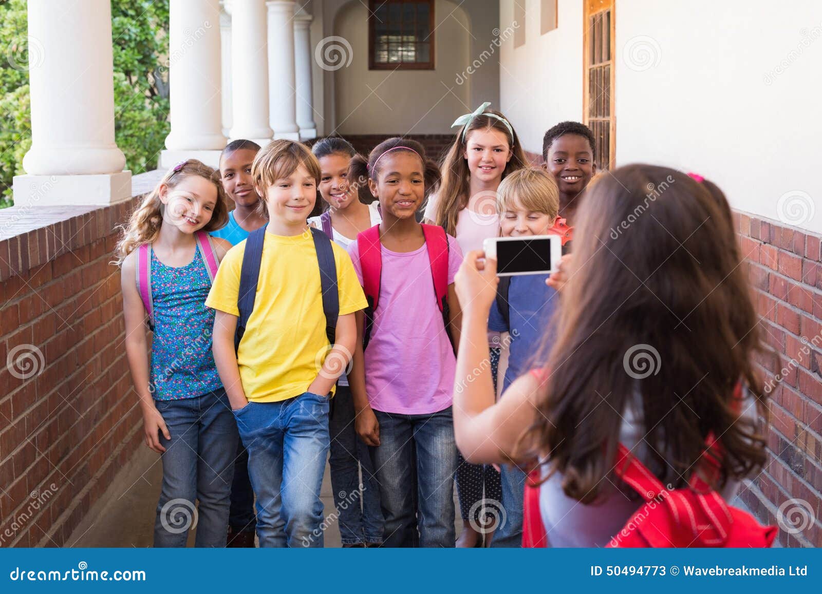 Cute Pupils Using Mobile Phone Stock Image - Image of cellphone ...