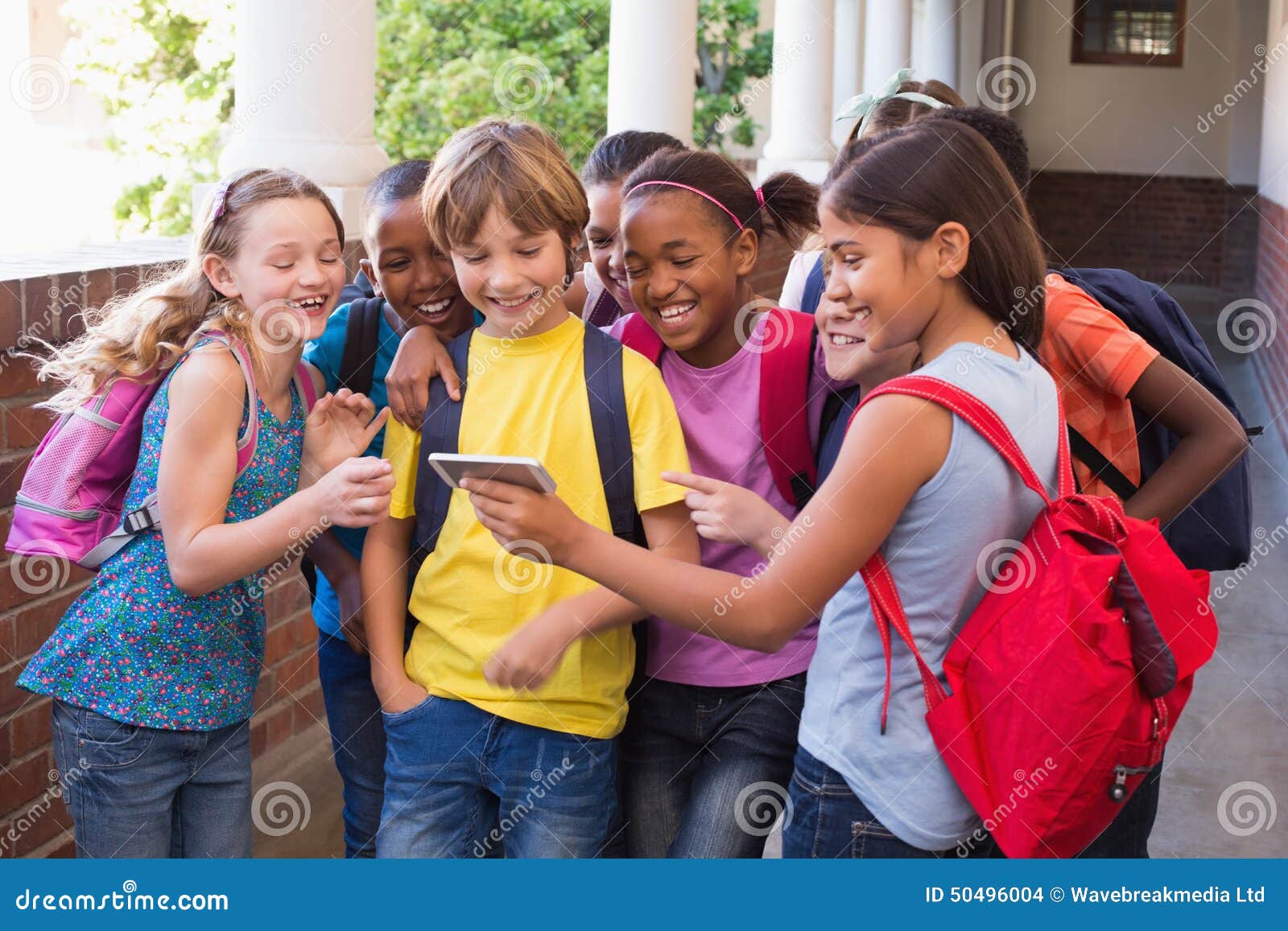 Cute Pupils Using Mobile Phone Stock Photo - Image of digital ...