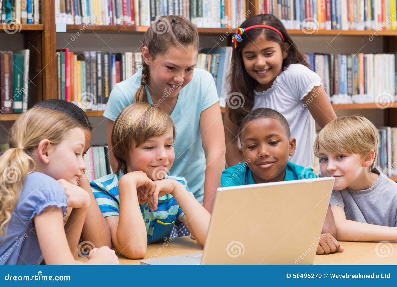 Cute Pupils Using Tablet Computer in Library Stock Photo - Image of ...