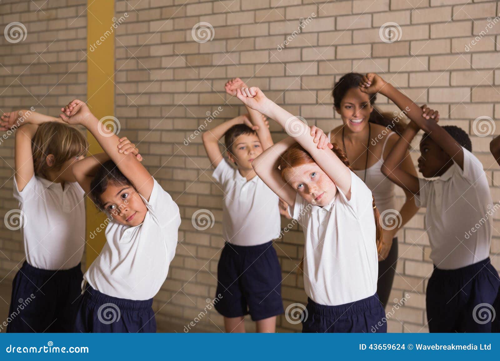 Cute Pupils Warming Up in PE Uniform Stock Photo - Image of class, view ...