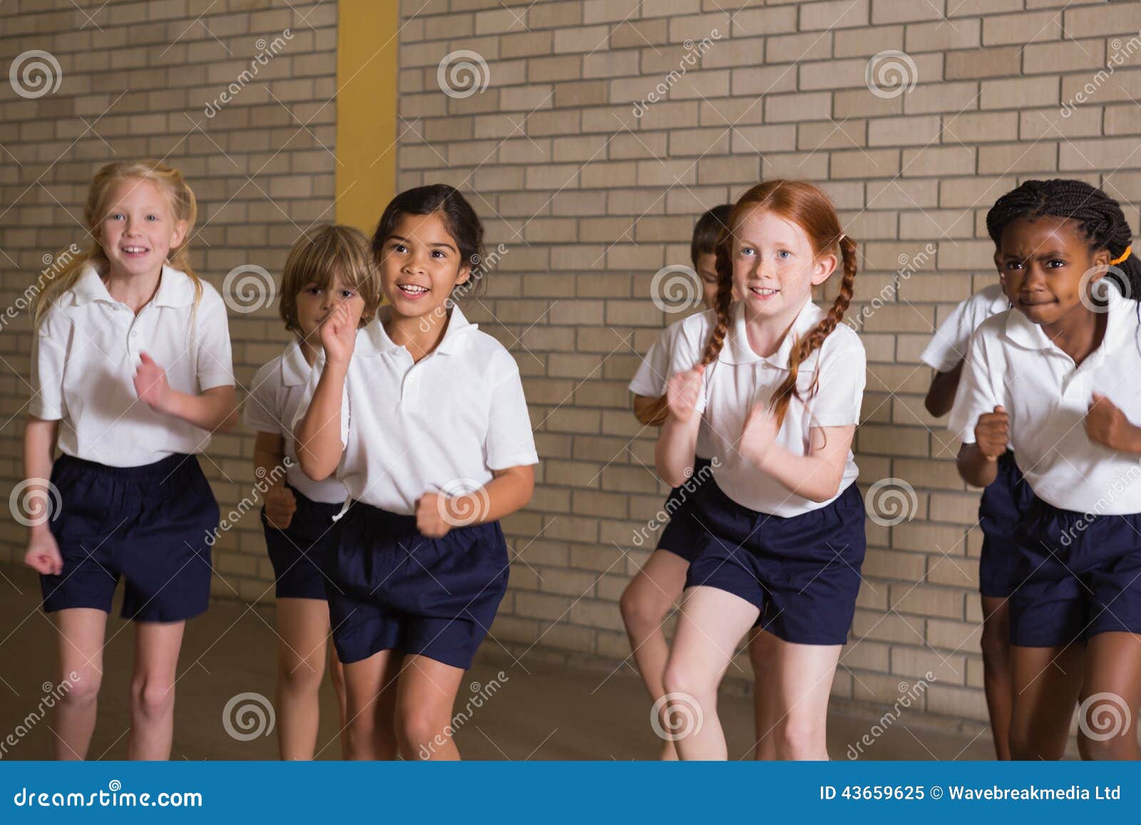 Cute Pupils Warming Up in PE Uniform Stock Image - Image of hispanic ...
