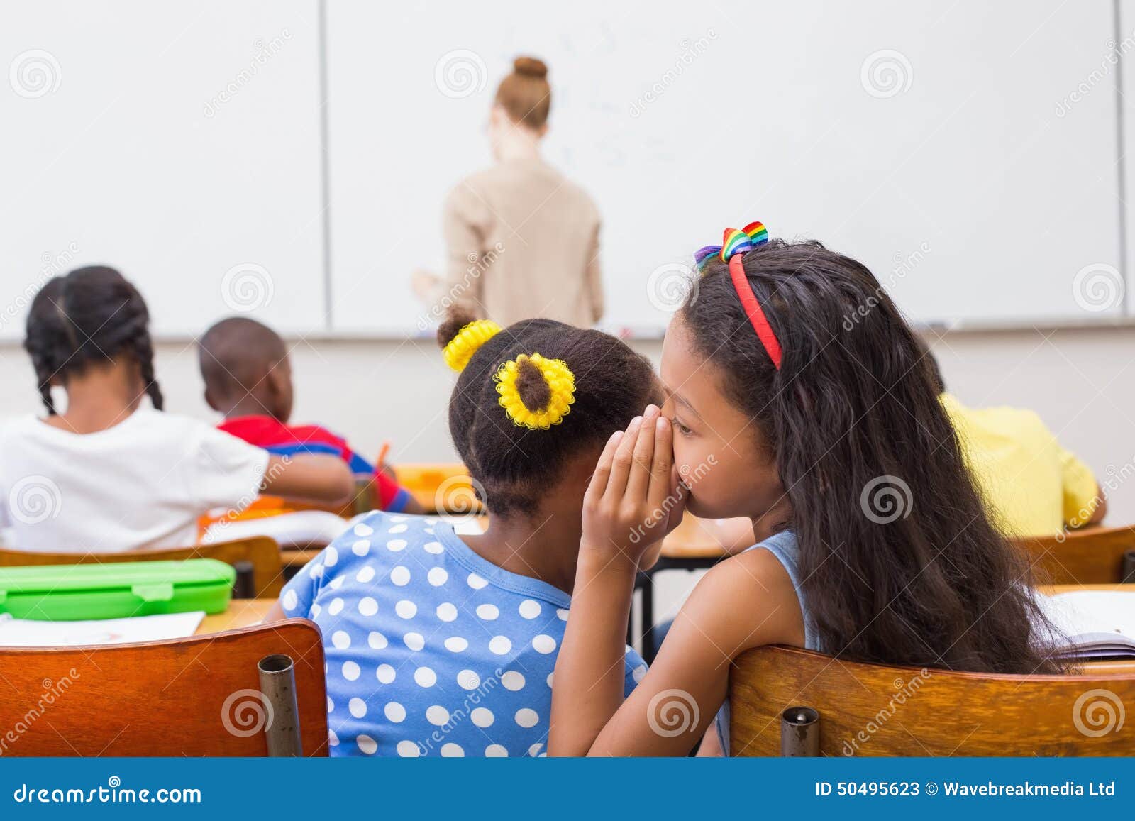 Cute Pupils Whispering in Classroom Stock Image - Image of indoors ...