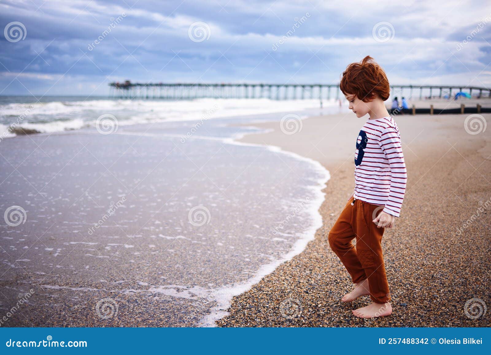Cute Redhead Boy Having Fun at the Beach, Walking Along the Ocean Shore ...