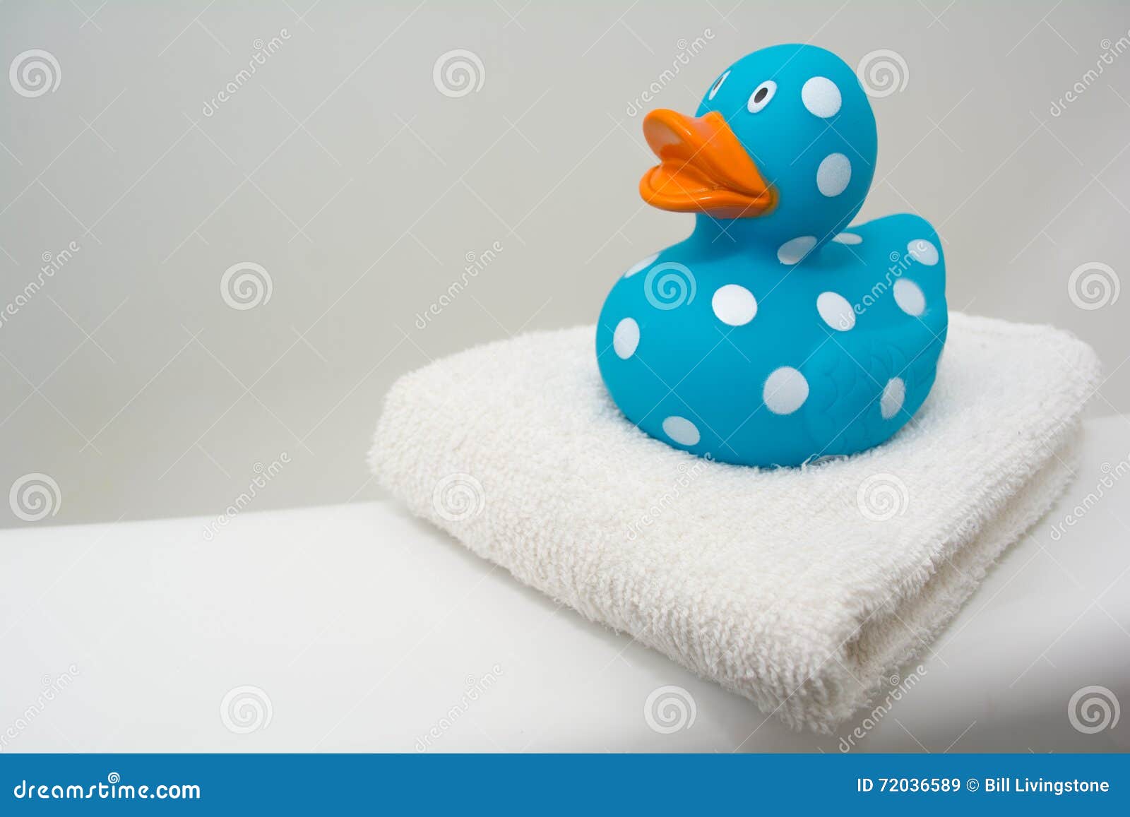 Cute Rubber Duck on a White Towel in a Bathroom Stock Image - Image of ...