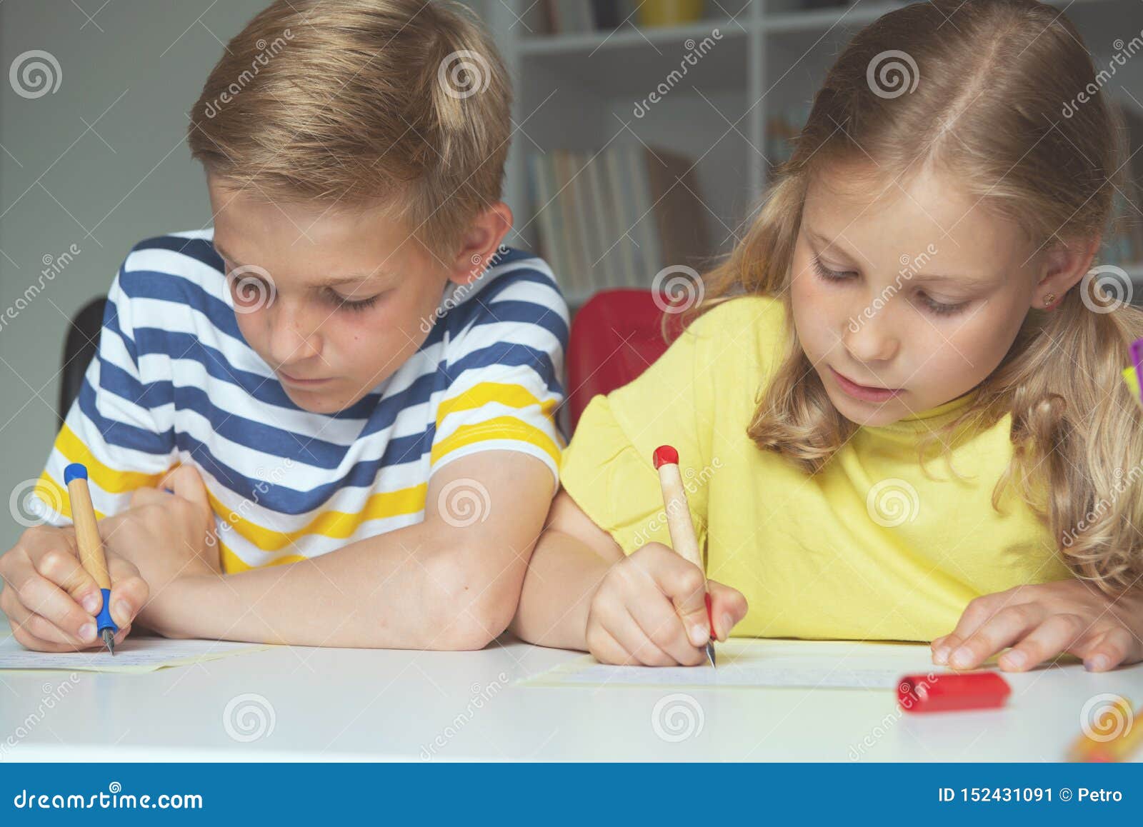 Cute Schoolchildren are Came Back To School and Learning at the Table ...
