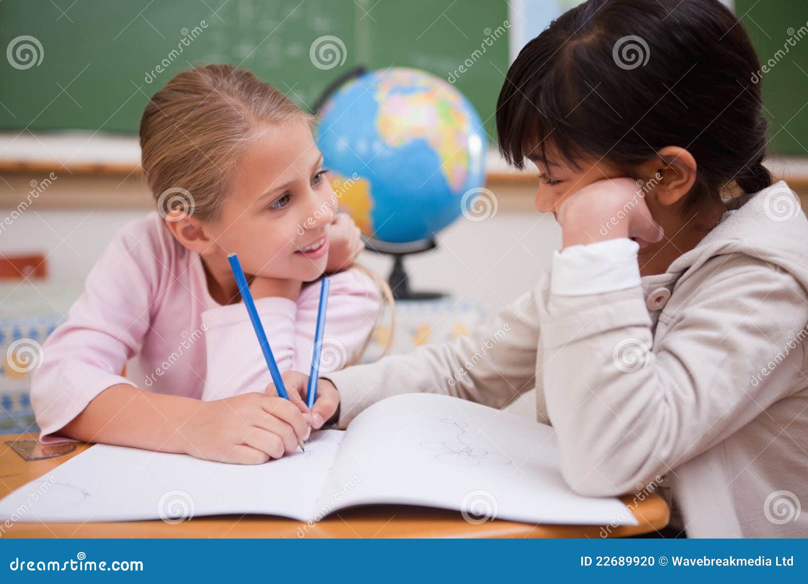 Cute Schoolgirls Doing Classwork Stock Photo - Image of reading, lesson ...